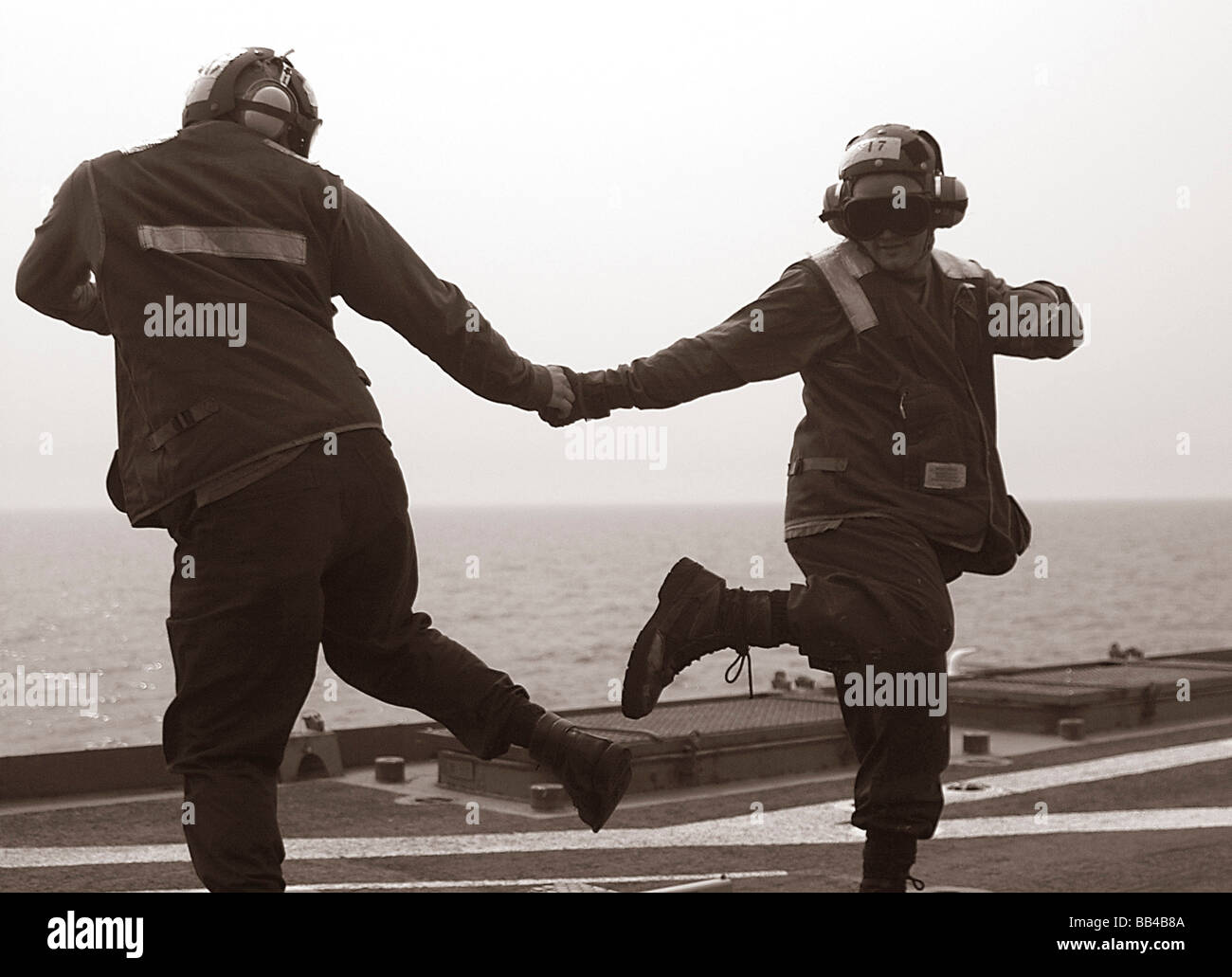 Sailors Dancing on Flight Deck Stock Photo - Alamy