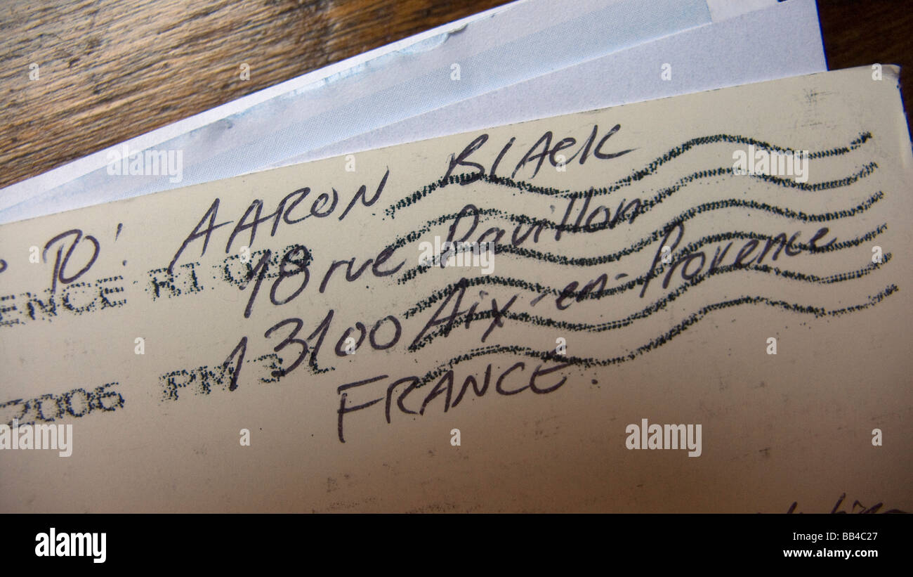 A detail or marco image of a letter showing postage and french address ...