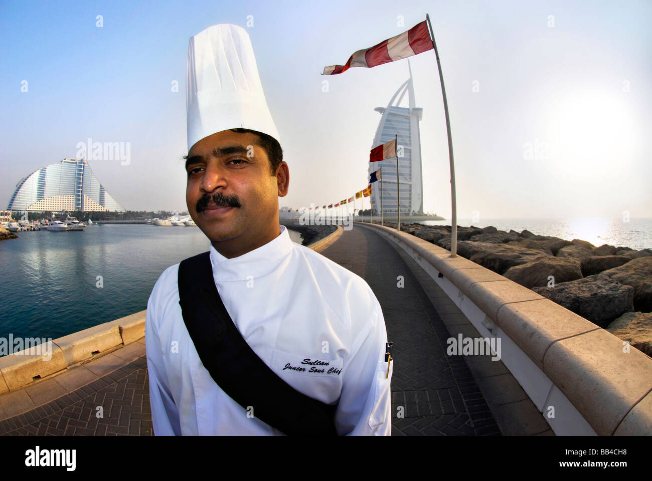Chef in Dubai with Burj Al Arab & Jumeirah Beach Hotel in background ...
