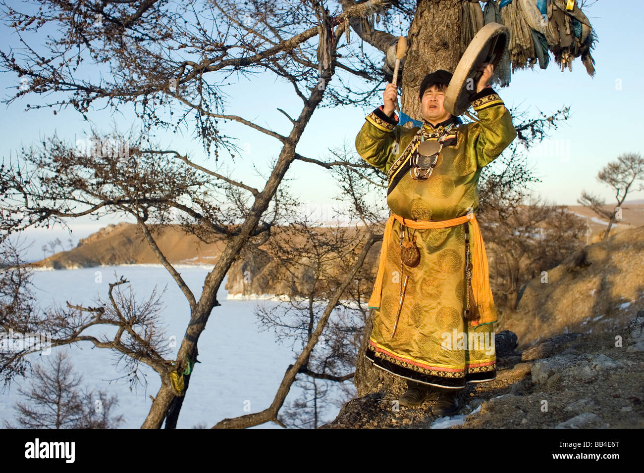 A Shaman performs a ceremonial ritual on Olkhon Island, Siberia, Russia ...