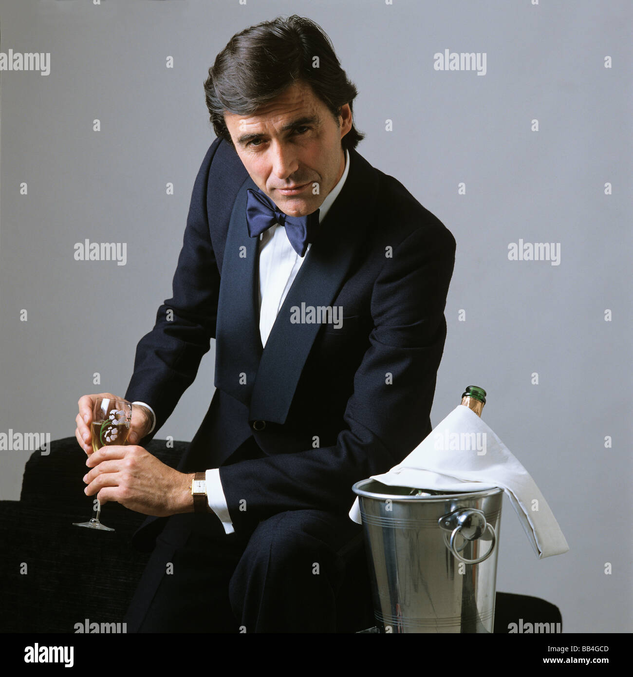 MAN WITH SMOKING DRESS AND CHAMPAGNE Stock Photo - Alamy