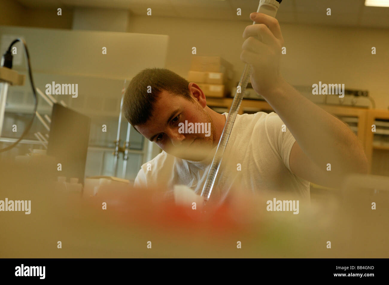 A young caucasian male works on a science experiment in the lab Stock ...