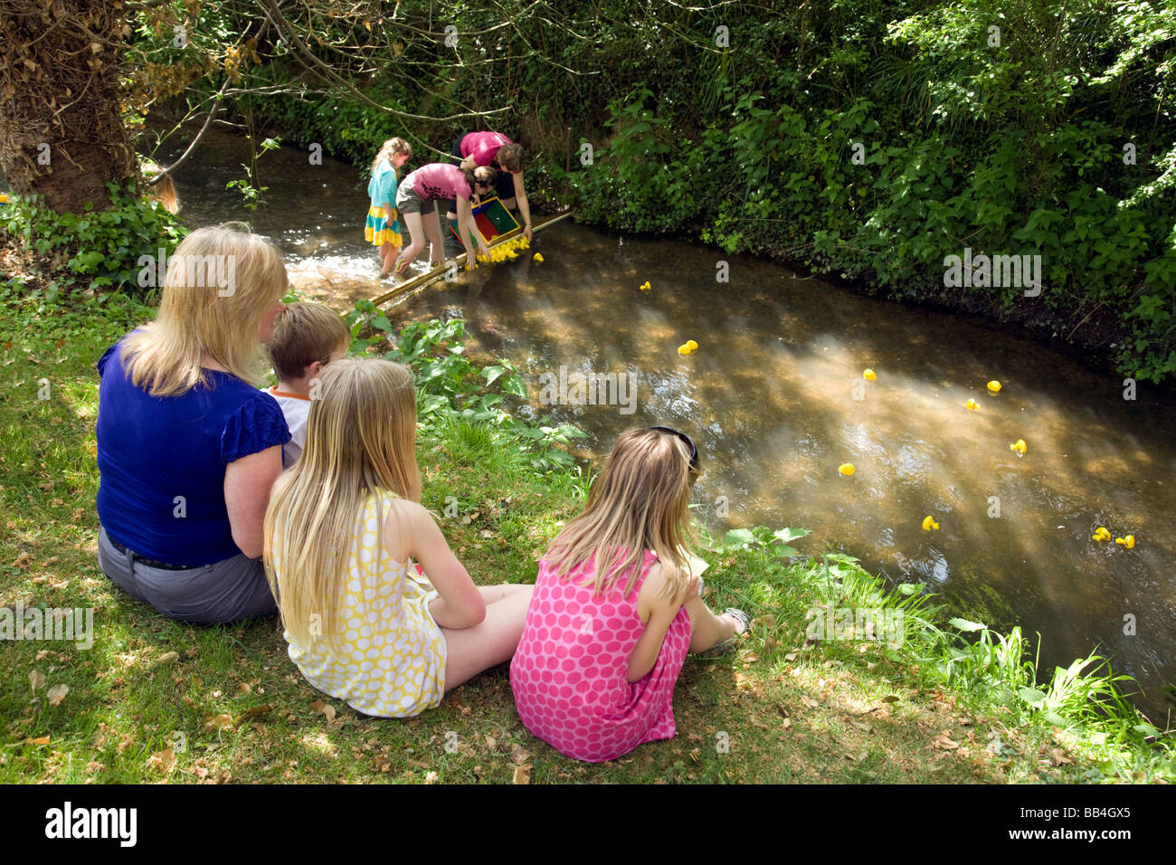 People watching a Charity plastic duck race at Wallingford, Oxfordshire ...