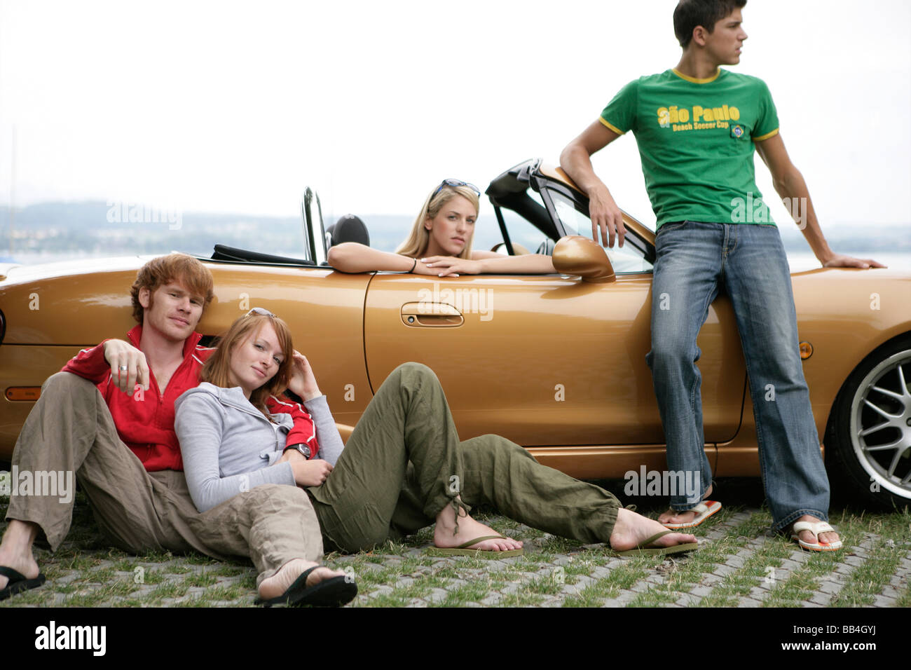 Young woman in car a clique in front of a car Stock Photo - Alamy