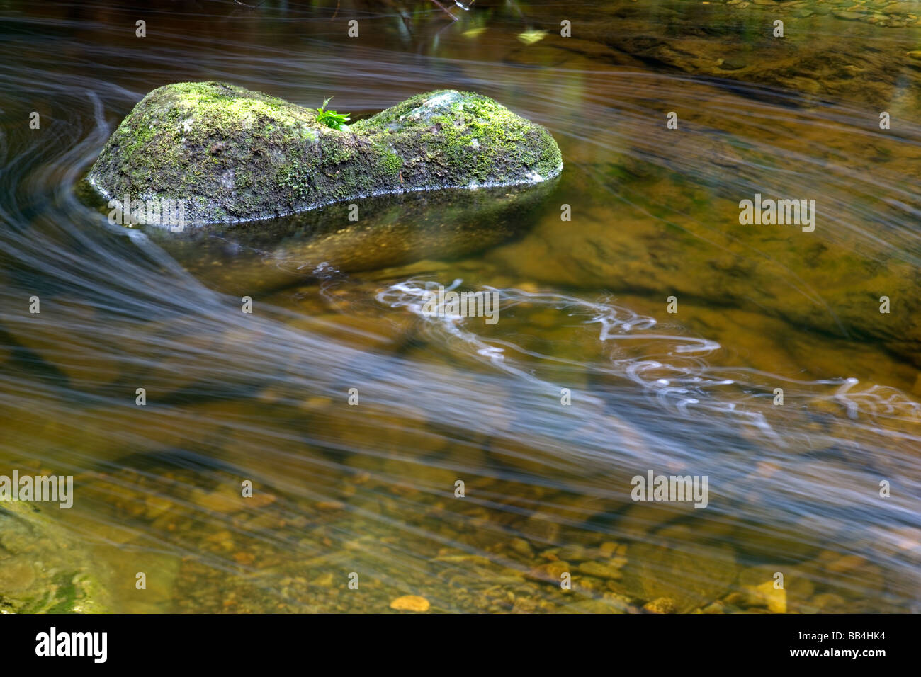 Flow lines around a rock at Barcaldine Oban scotland Stock Photo - Alamy