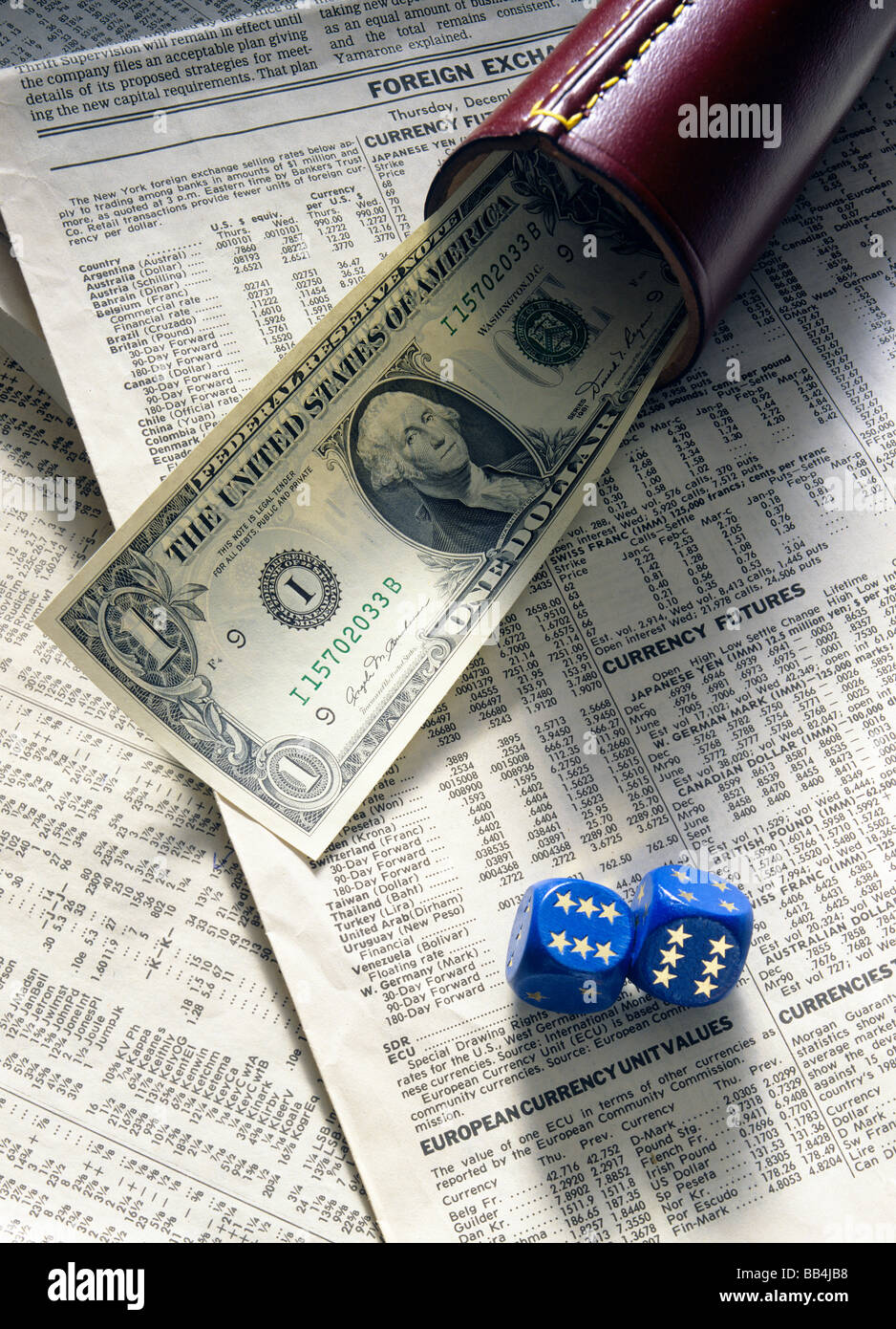 FINANCIAL NEWSPAPER WITH DOLLAR BILL AND EUROPEAN DICE Stock Photo - Alamy