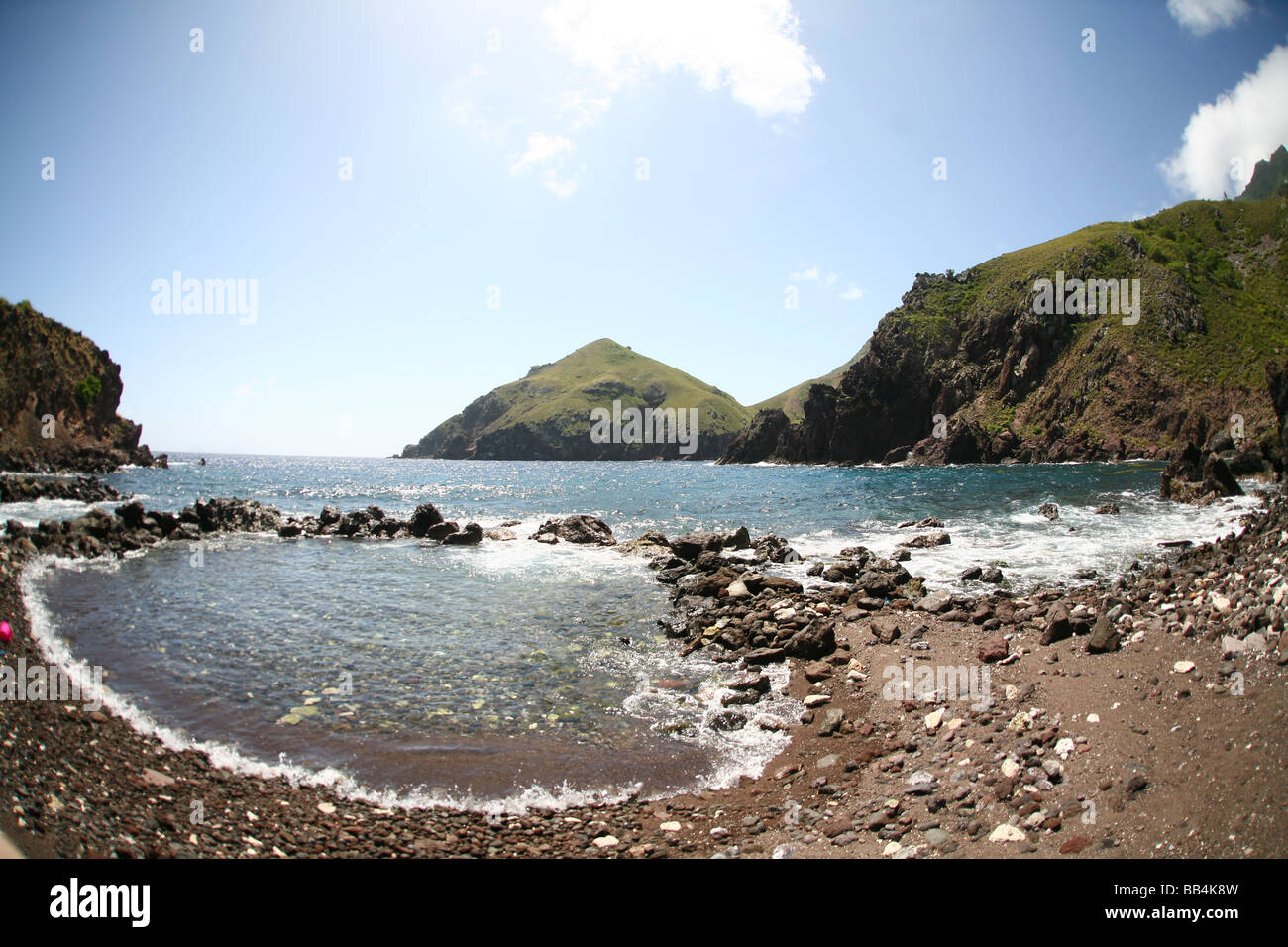 View over an ocean pool from the rocky beach of the Caribbean isle Saba ...