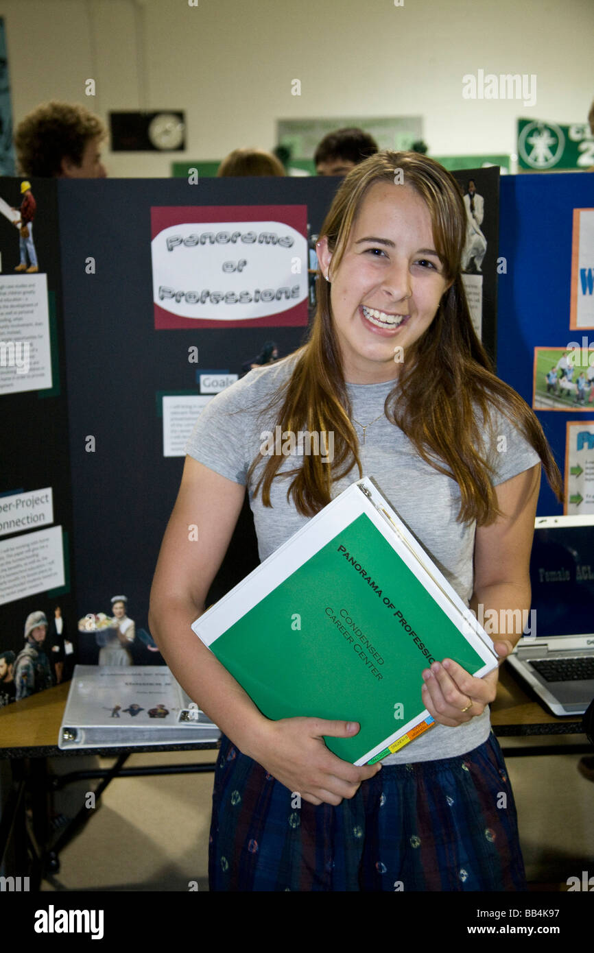 A casual portrait of a teenage girl with her high school presentation ...