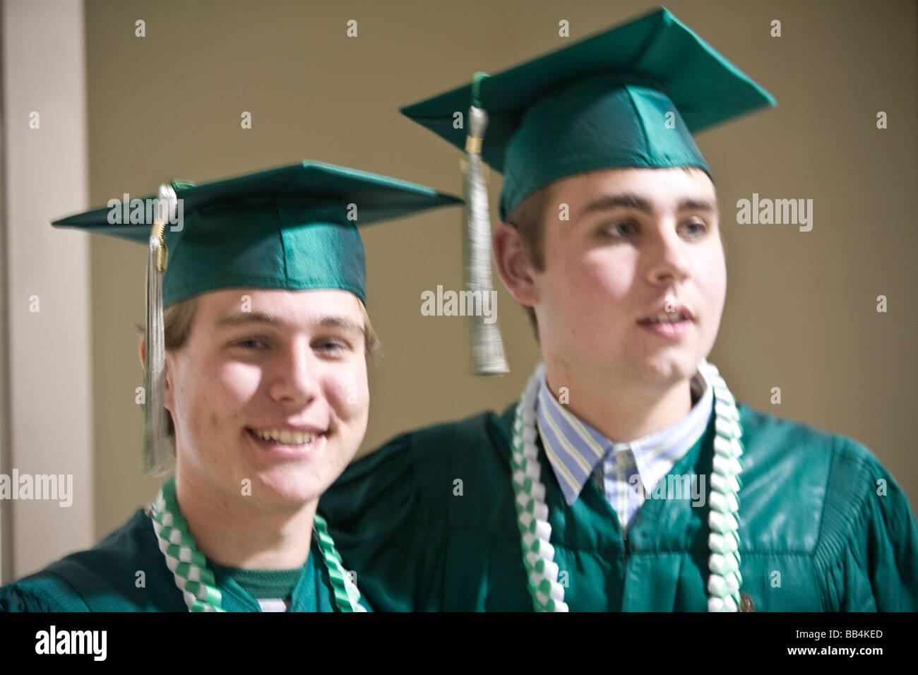 Two teenage boys stand together at graduation Stock Photo - Alamy