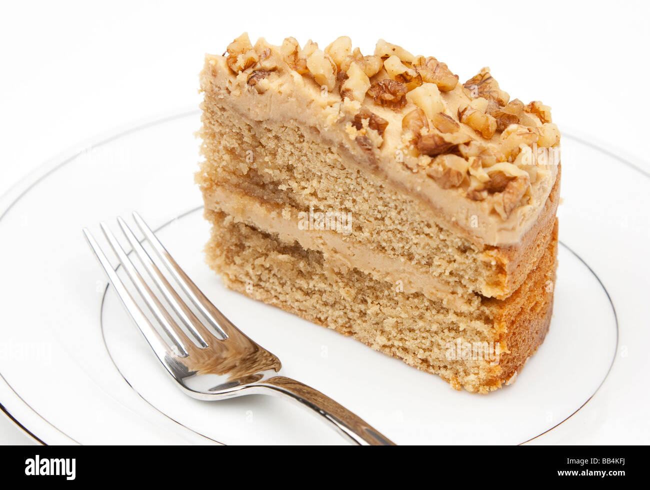 coffee cream sponge cake covered in walnuts Stock Photo - Alamy