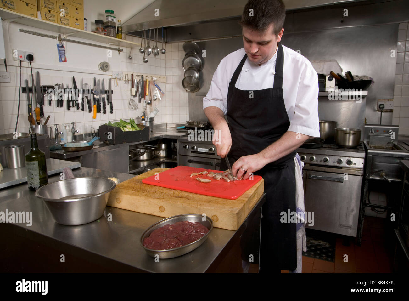 Professional chef at work in a restaurant kitchen Stock Photo - Alamy