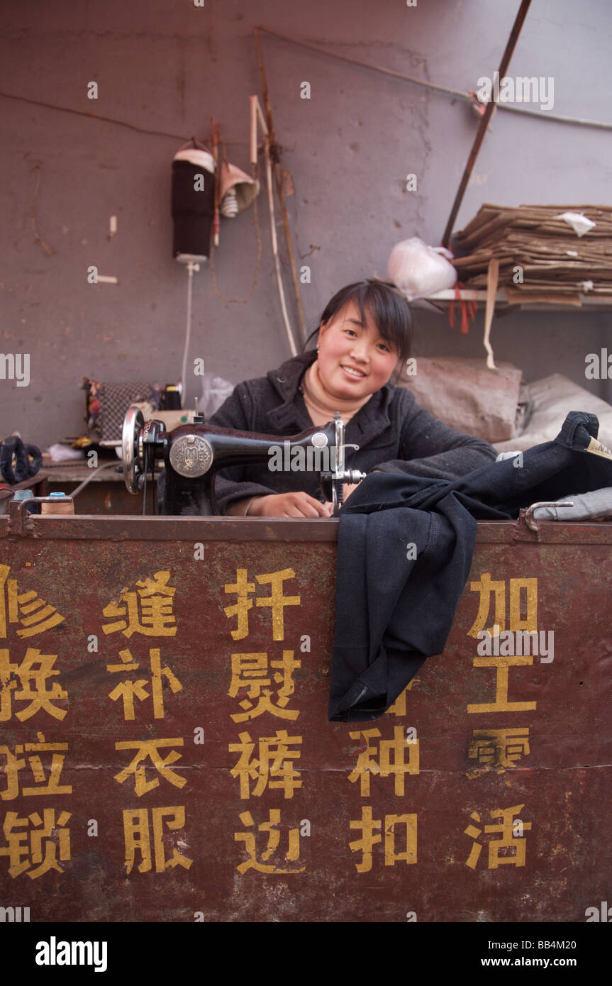 Mending clothes hi-res stock photography and images - Alamy
