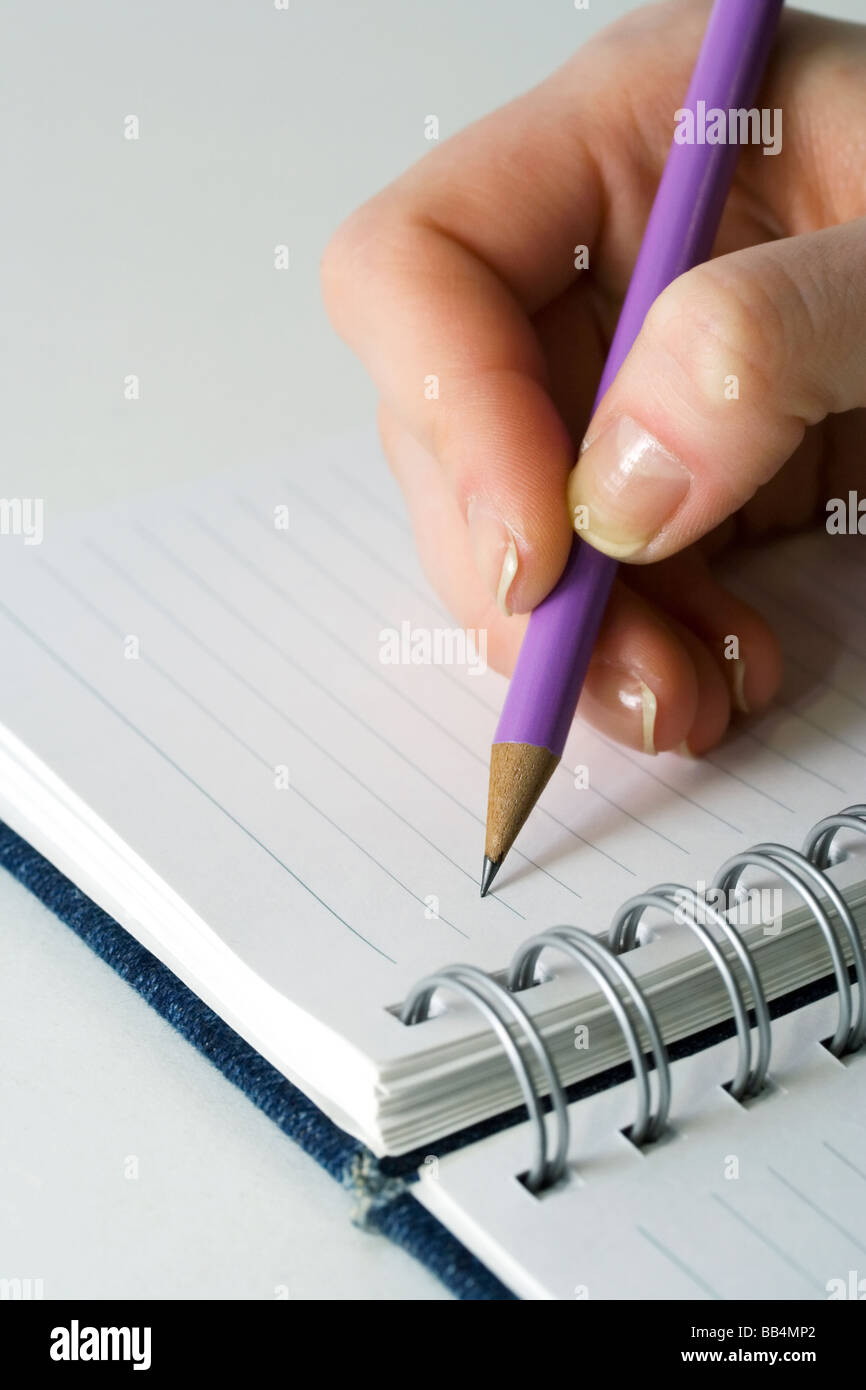 Female hand writing Stock Photo - Alamy
