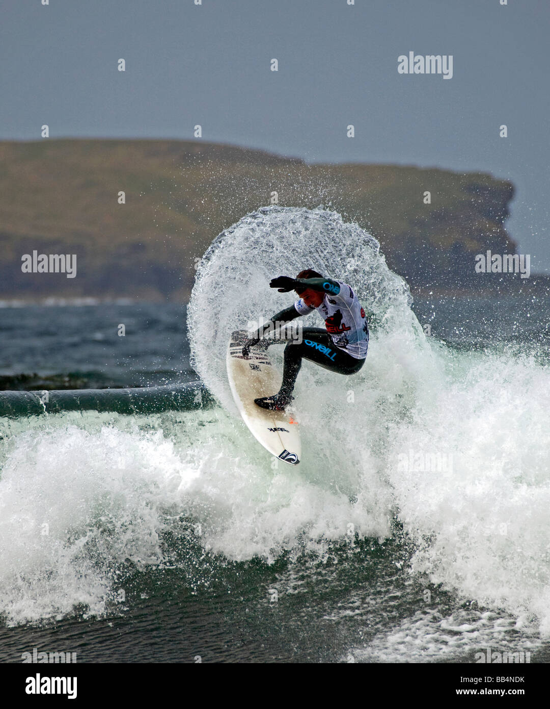 Surfer competing in O'Neill 'Cold Water Classic' surfing competition ...