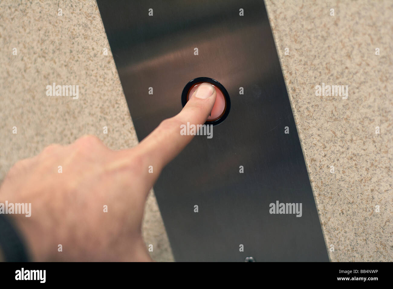 A hand pushing elevator buttons Stock Photo - Alamy