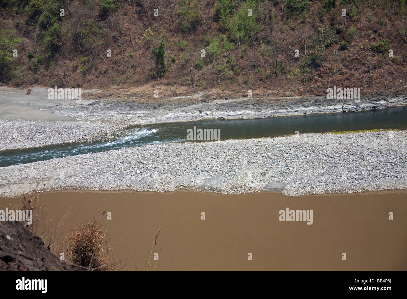 Muddy Trisuli River with "clean water" affluent from Annapurna Glacier ...