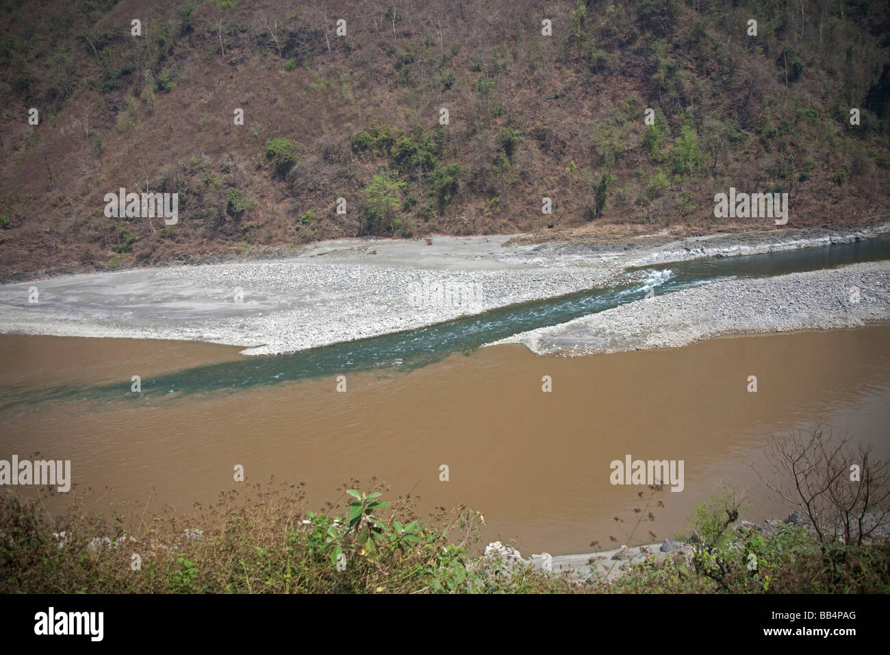 Muddy Trisuli River with "clean water " affluent from Annapurna Glacier ...
