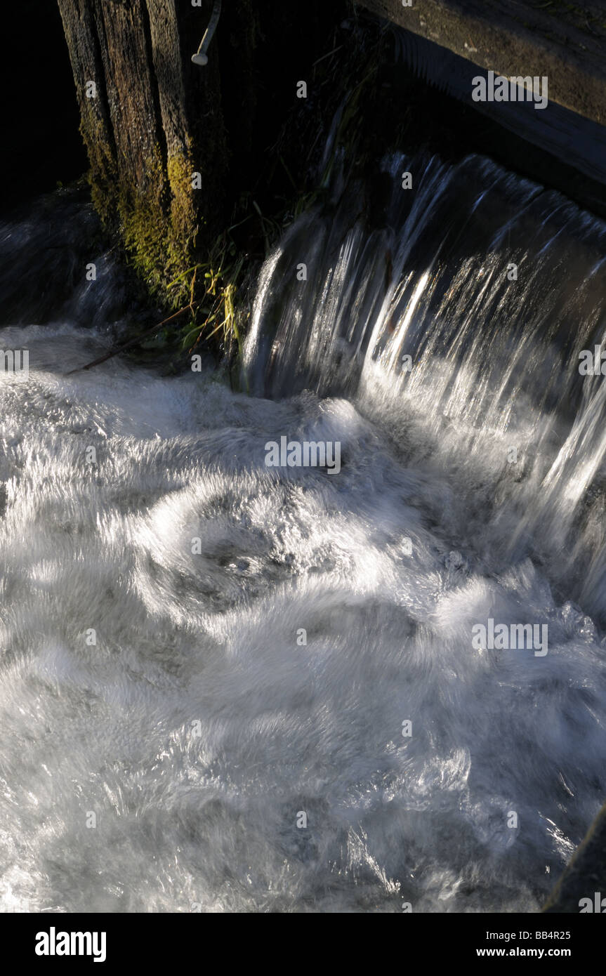 Water flowing down Weir Stock Photo - Alamy