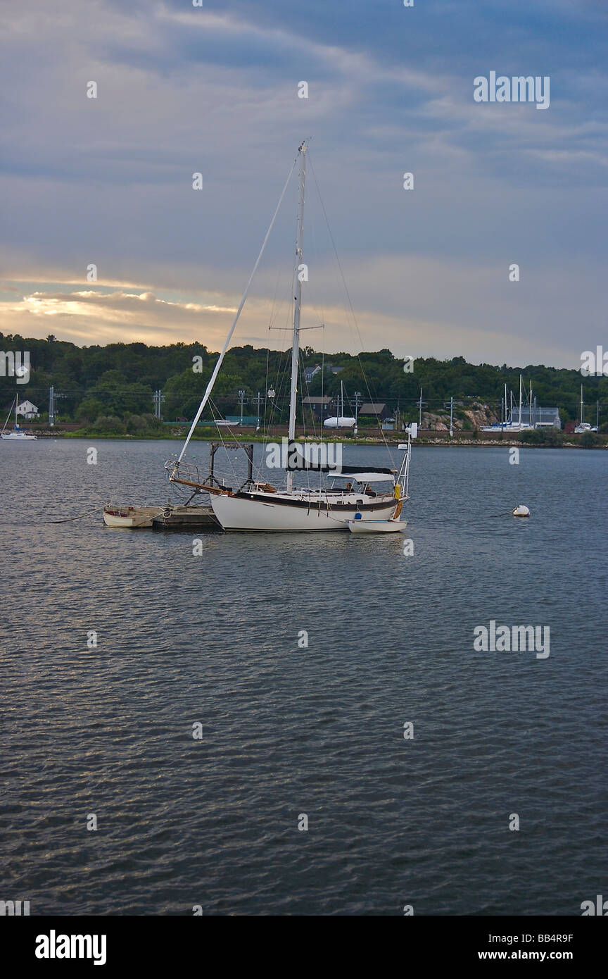North America, USA, Connecticut. A sailboat in the Mystic River Stock ...