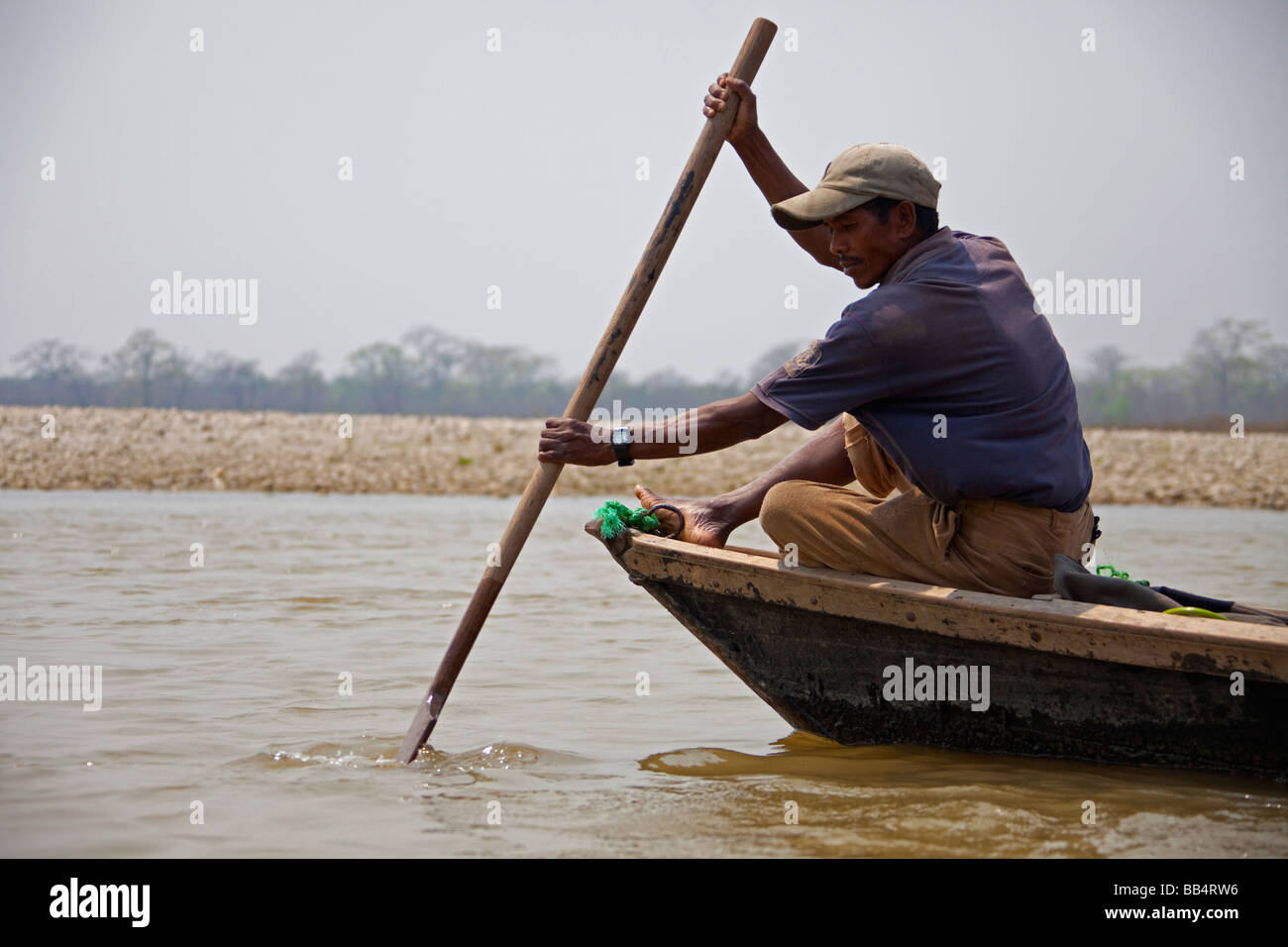 Man rawing on river in dugout boat nepal Horizontal 93194 Nepal-Chitwan ...