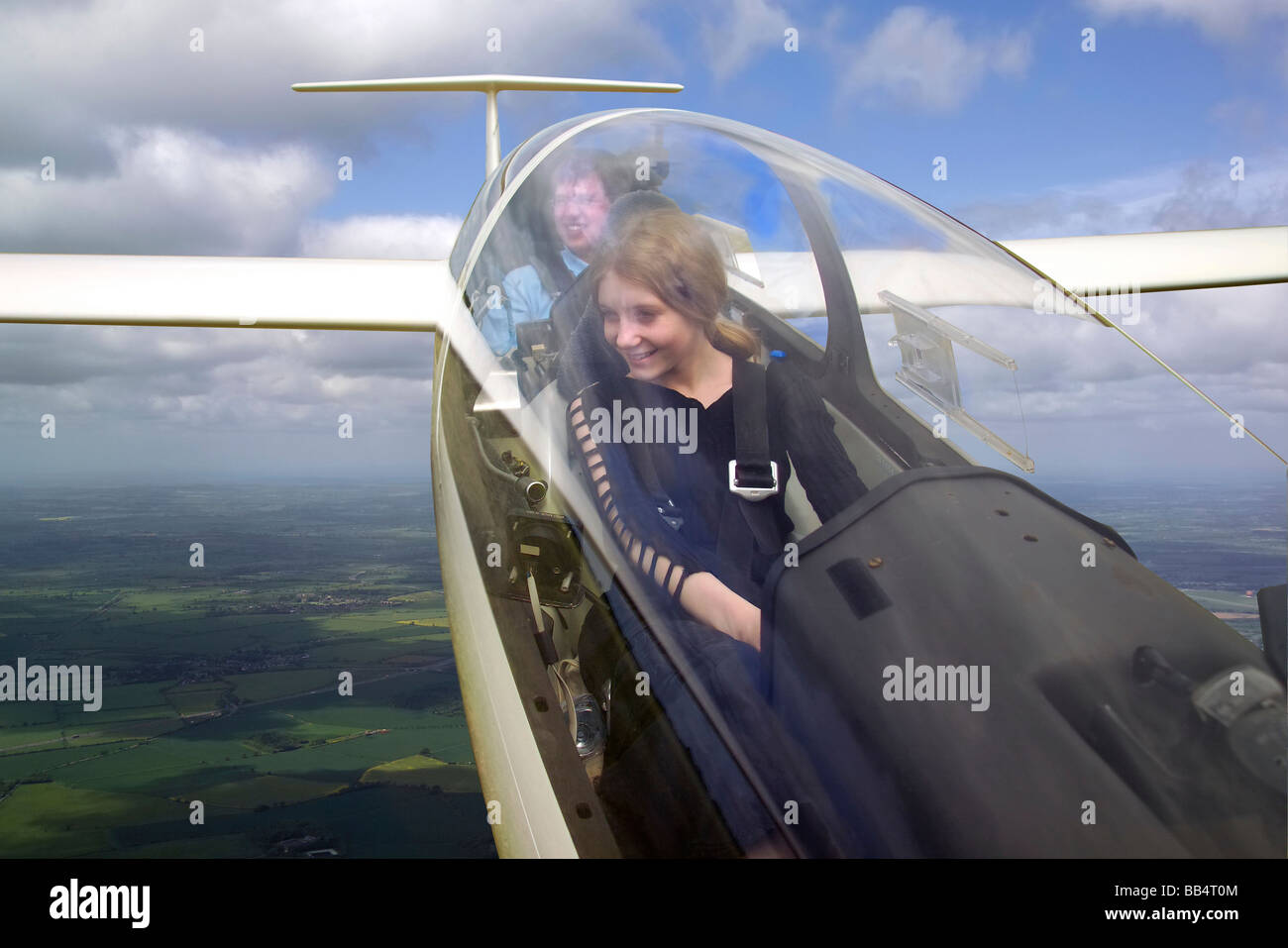 Girl flying glider Stock Photo - Alamy