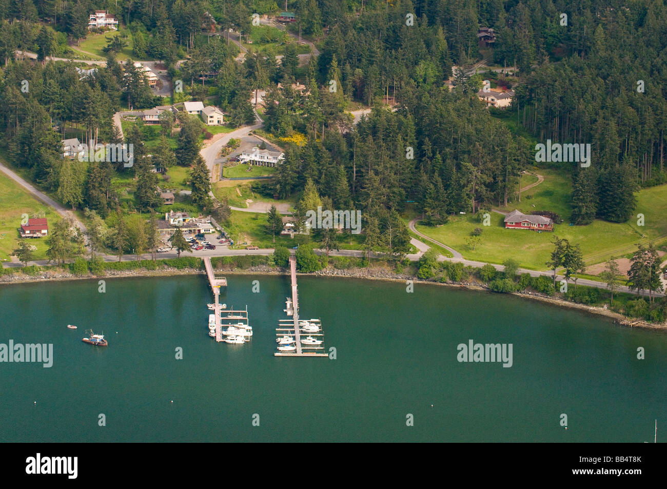 Aerial of homes and small marina on west side Lopez Island in Fisherman ...