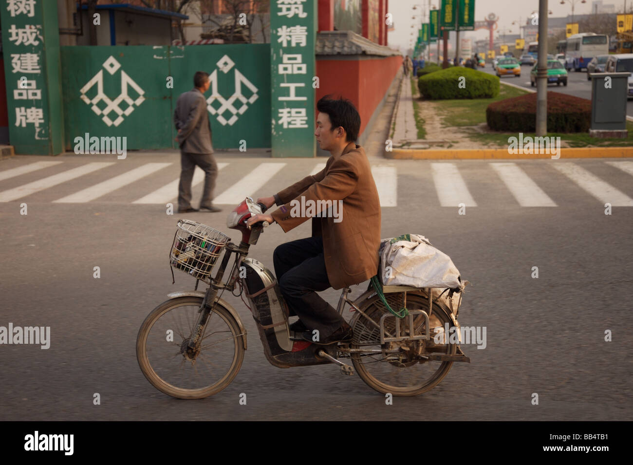 local man on bike in xi'an china Stock Photo - Alamy