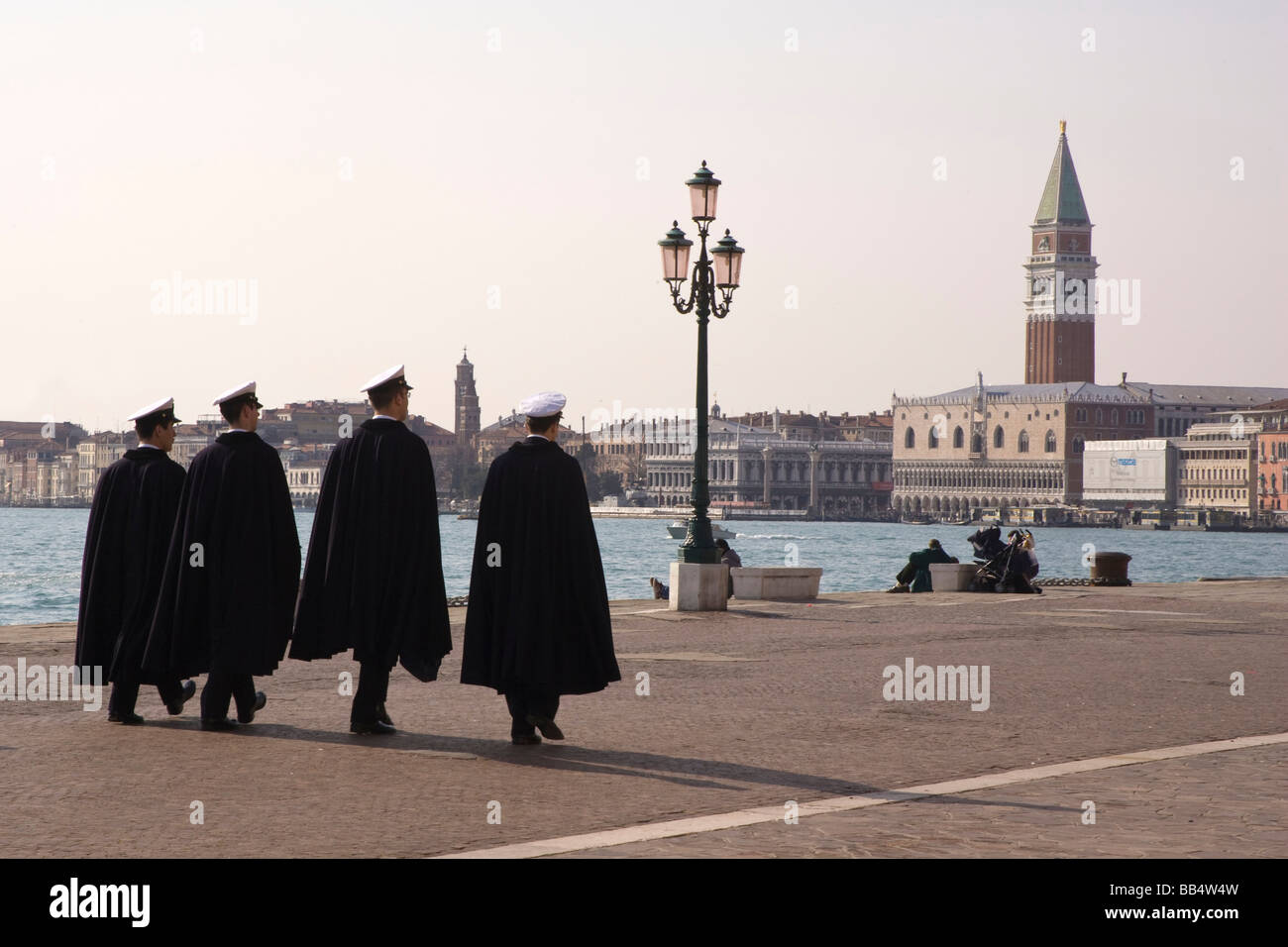 Europe Italy Venice. Four uniformed Navy men walking along the Riva ...