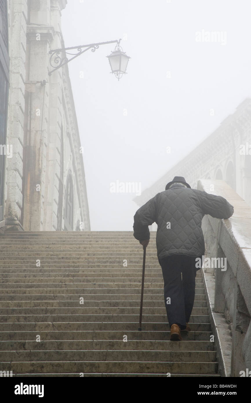 Man with cane on steps hi-res stock photography and images - Alamy
