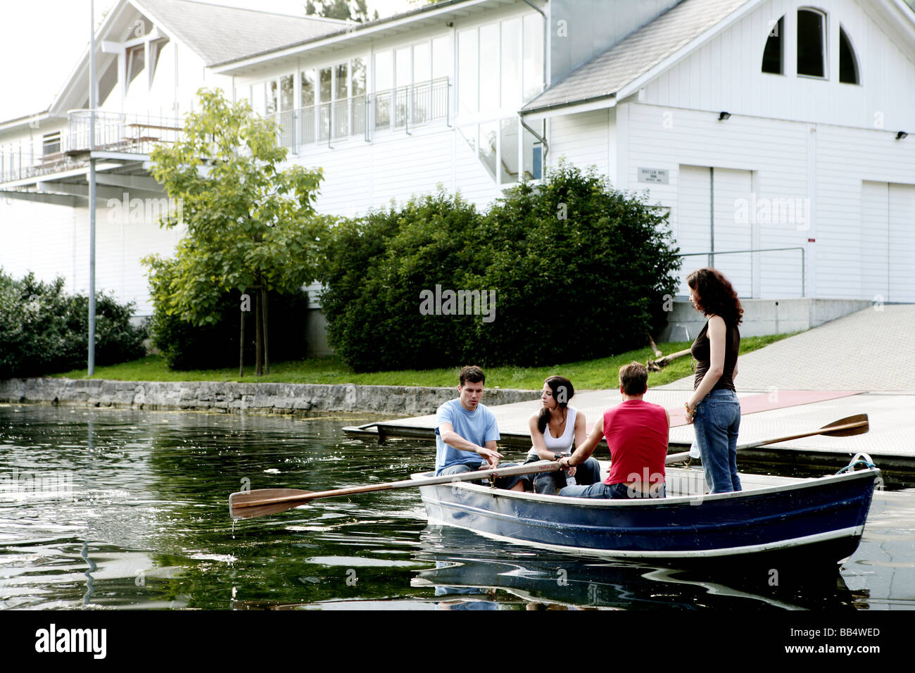 Man and woman in rowboat hi-res stock photography and images - Alamy