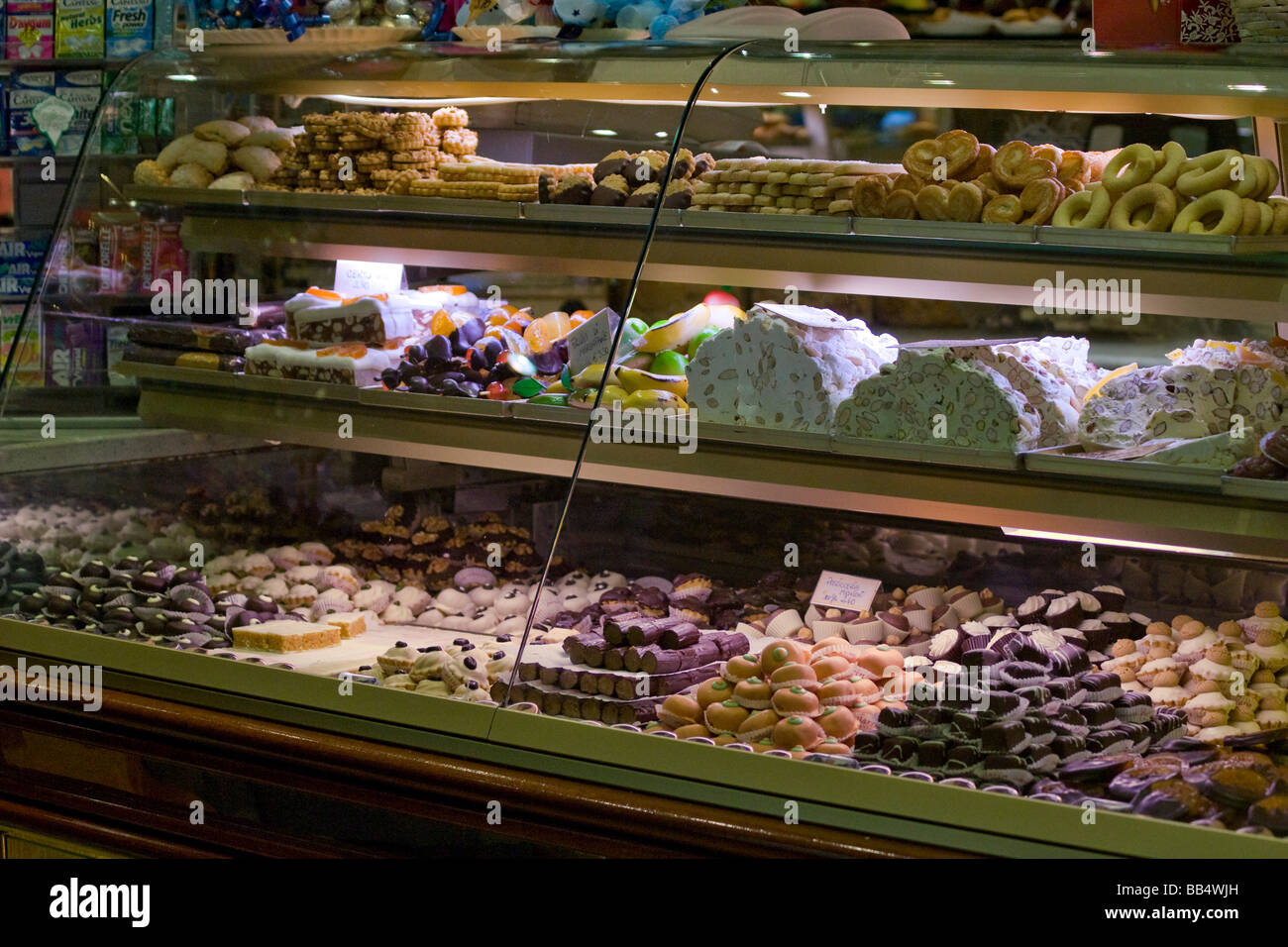 Europe, Italy, Venice. Glass display case filled with pastries and ...