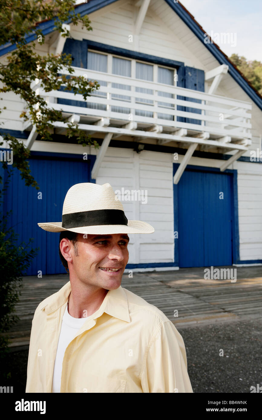 Portrait of man with head in front of a house Stock Photo - Alamy