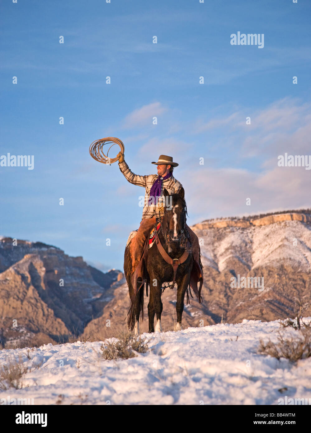Cowboy riding a horse on the range on The Hideout Ranch in Shell ...