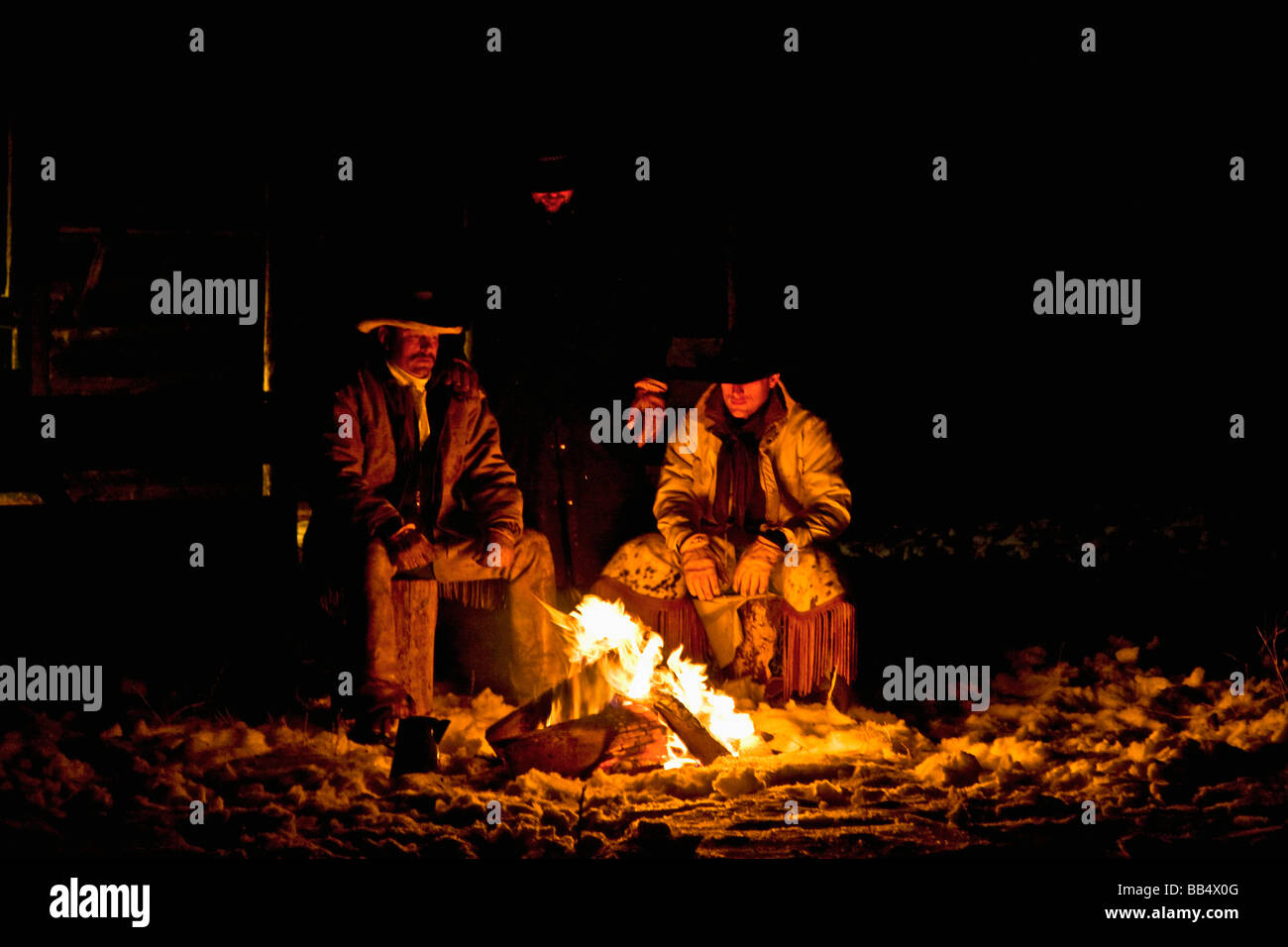 Cowboys around a campfire out on the range on The Hideout Ranch in ...