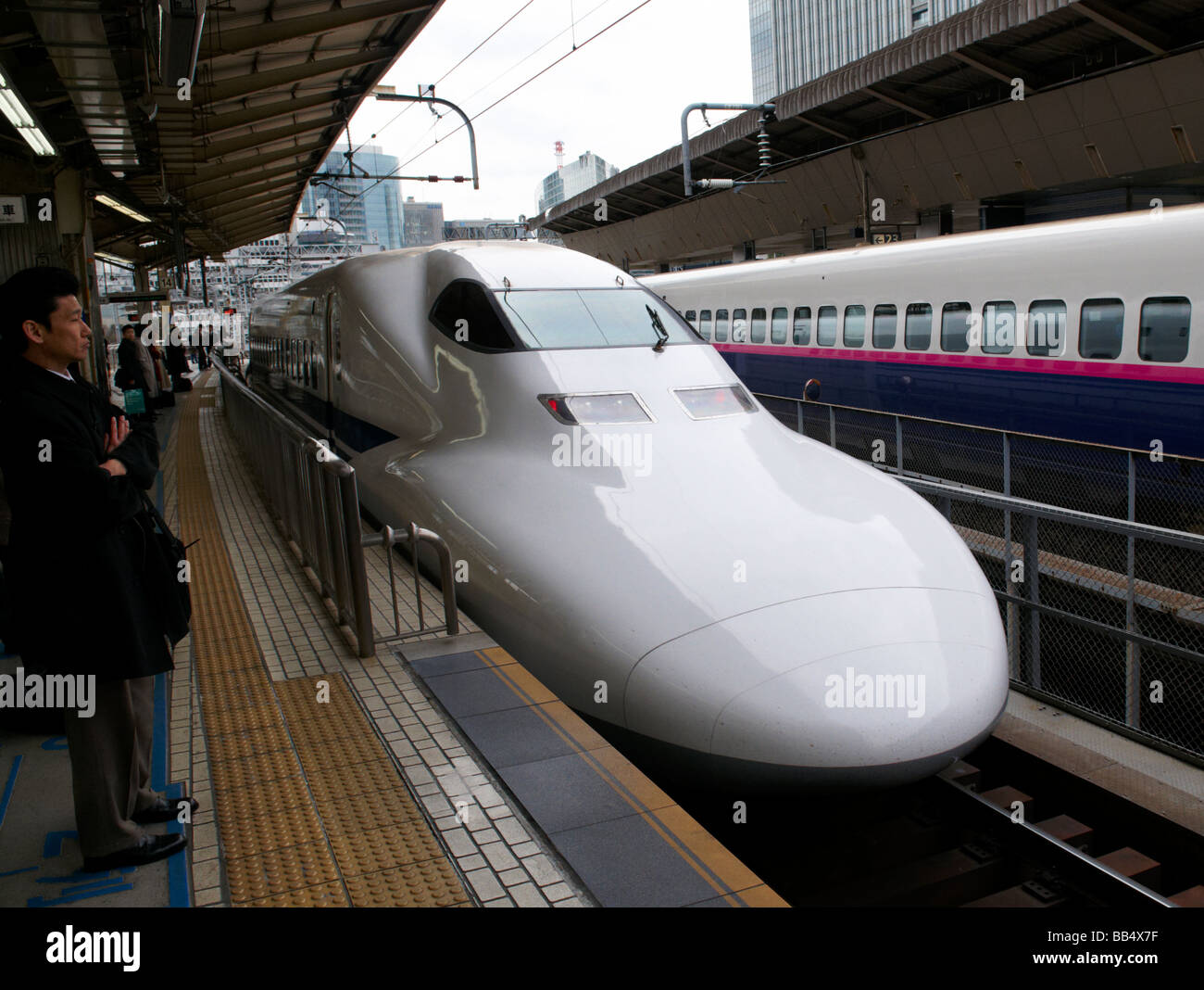 The Shinkansen (bullet train) pulls into a station, Japan Stock Photo ...