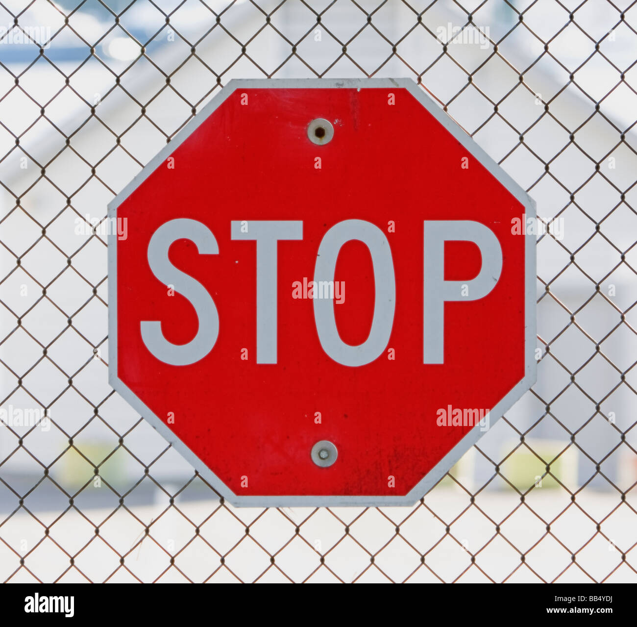 stop sign on fence Stock Photo - Alamy