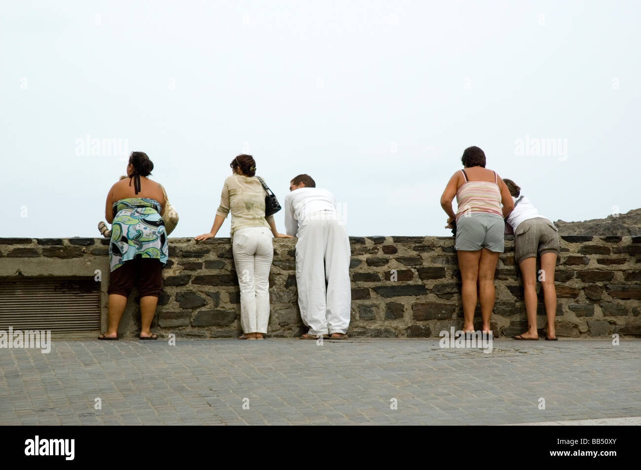 Over the wall curiosity hi-res stock photography and images - Alamy