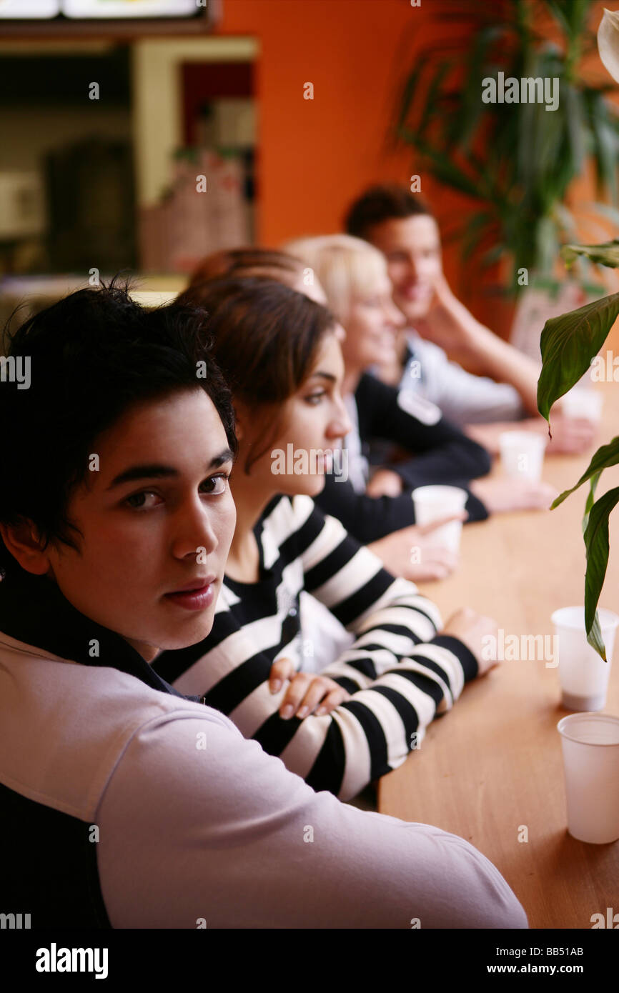 teenager group at bar table Stock Photo - Alamy
