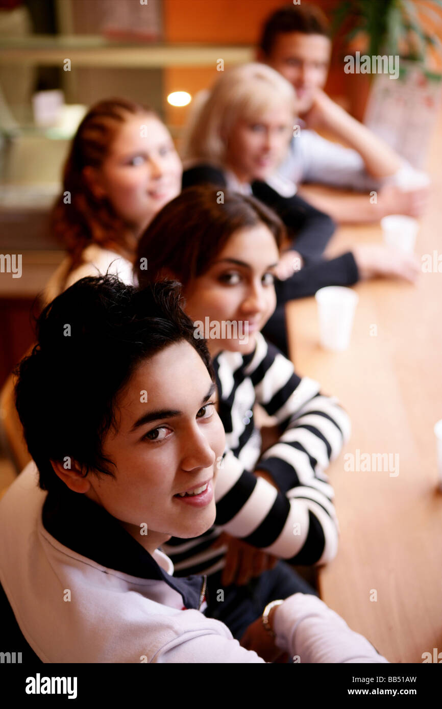 teenager group at bar table Stock Photo - Alamy