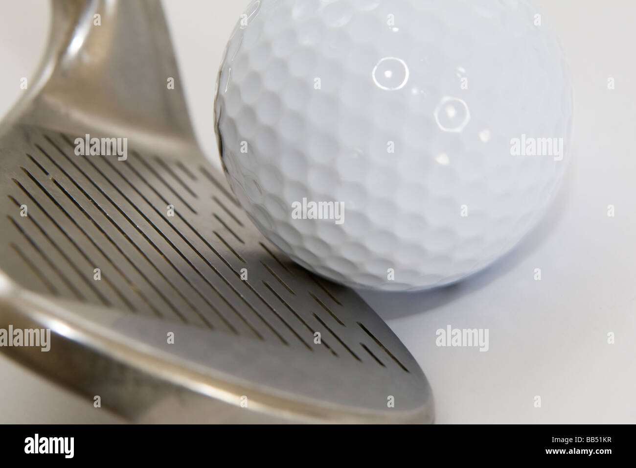 Golf equipment - Sand iron and ball Stock Photo - Alamy