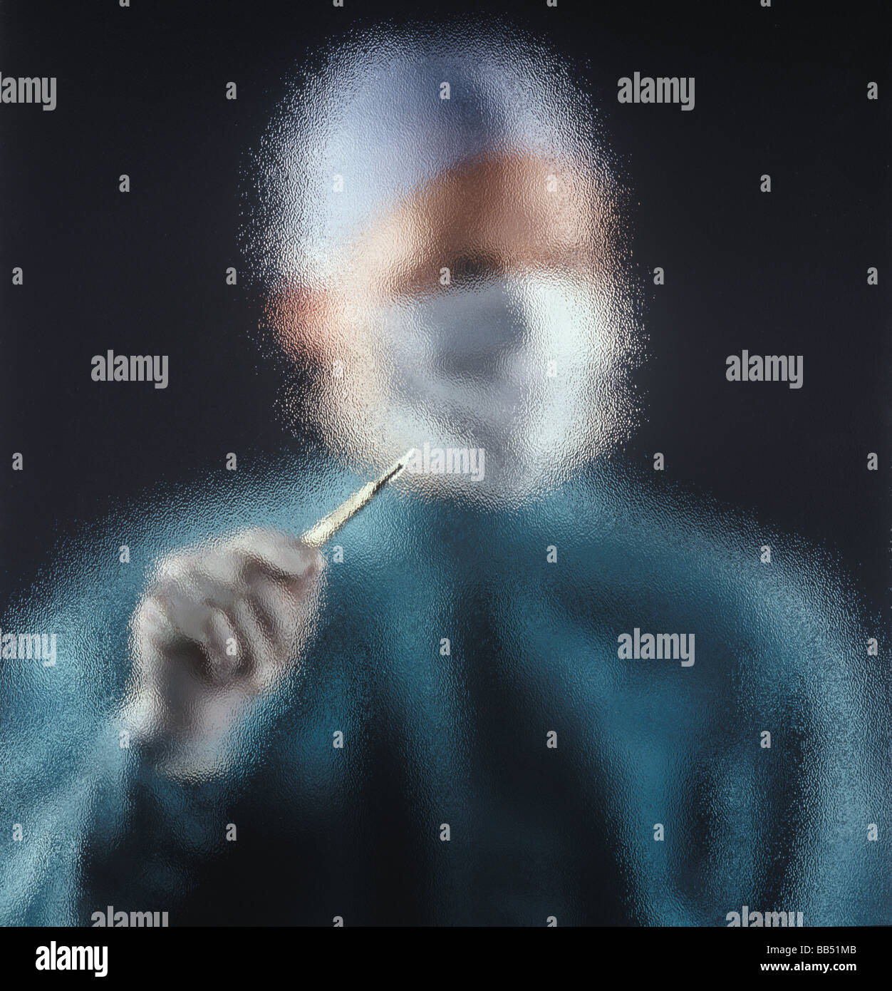 surgeon with scalpel behind glass Stock Photo - Alamy