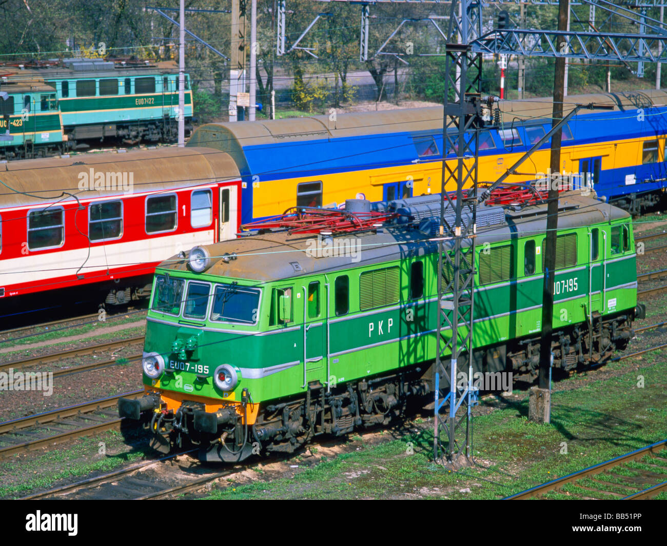 Poznan, Wielkopolska, Poland. Trains on track by main station. Brightly ...