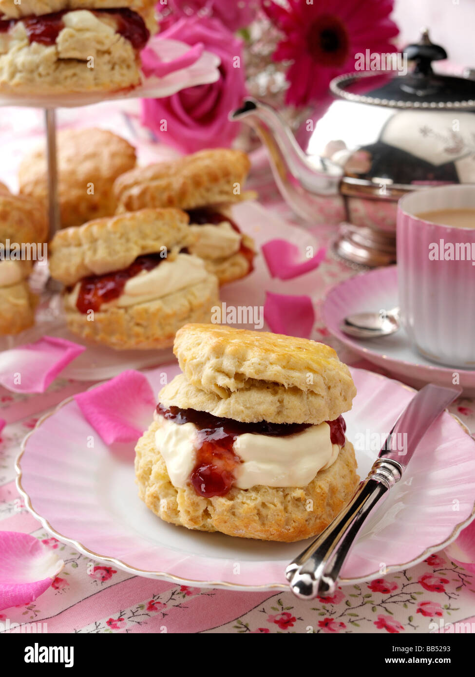 Scones with jam and clotted cream with tea set Stock Photo - Alamy