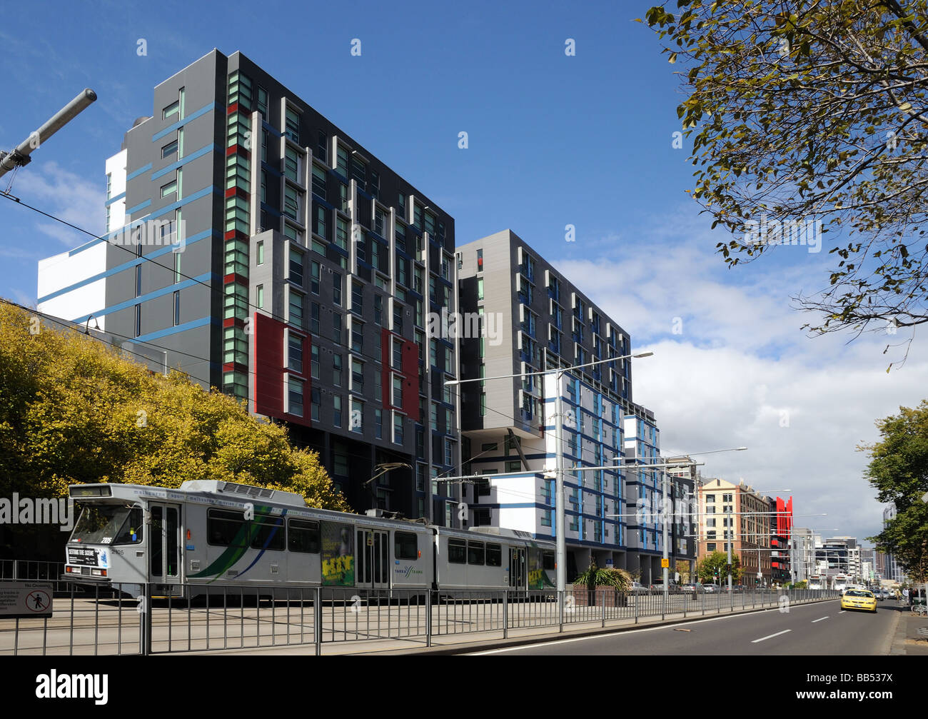 Tram of Yarra Trams with tall modern buildings office blocks flats ...