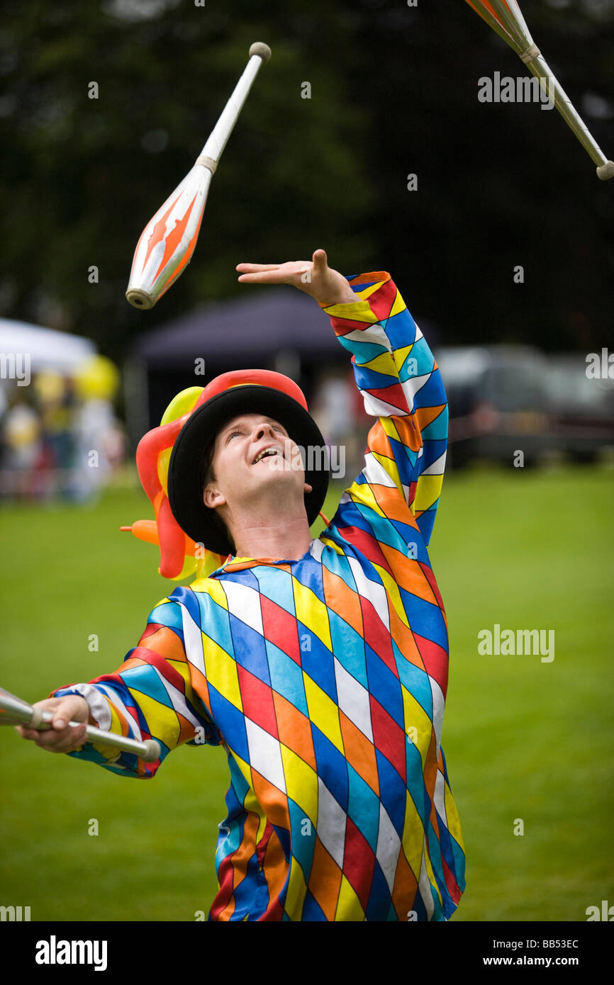 A performer juggling at a town festival Stock Photo - Alamy