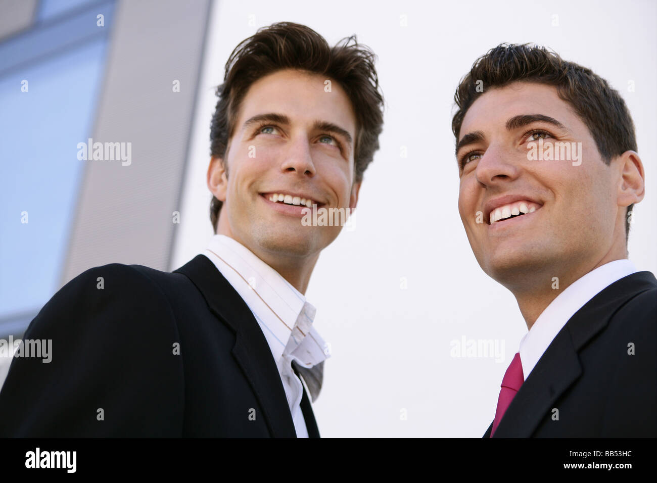 Business men smiling outside Stock Photo - Alamy