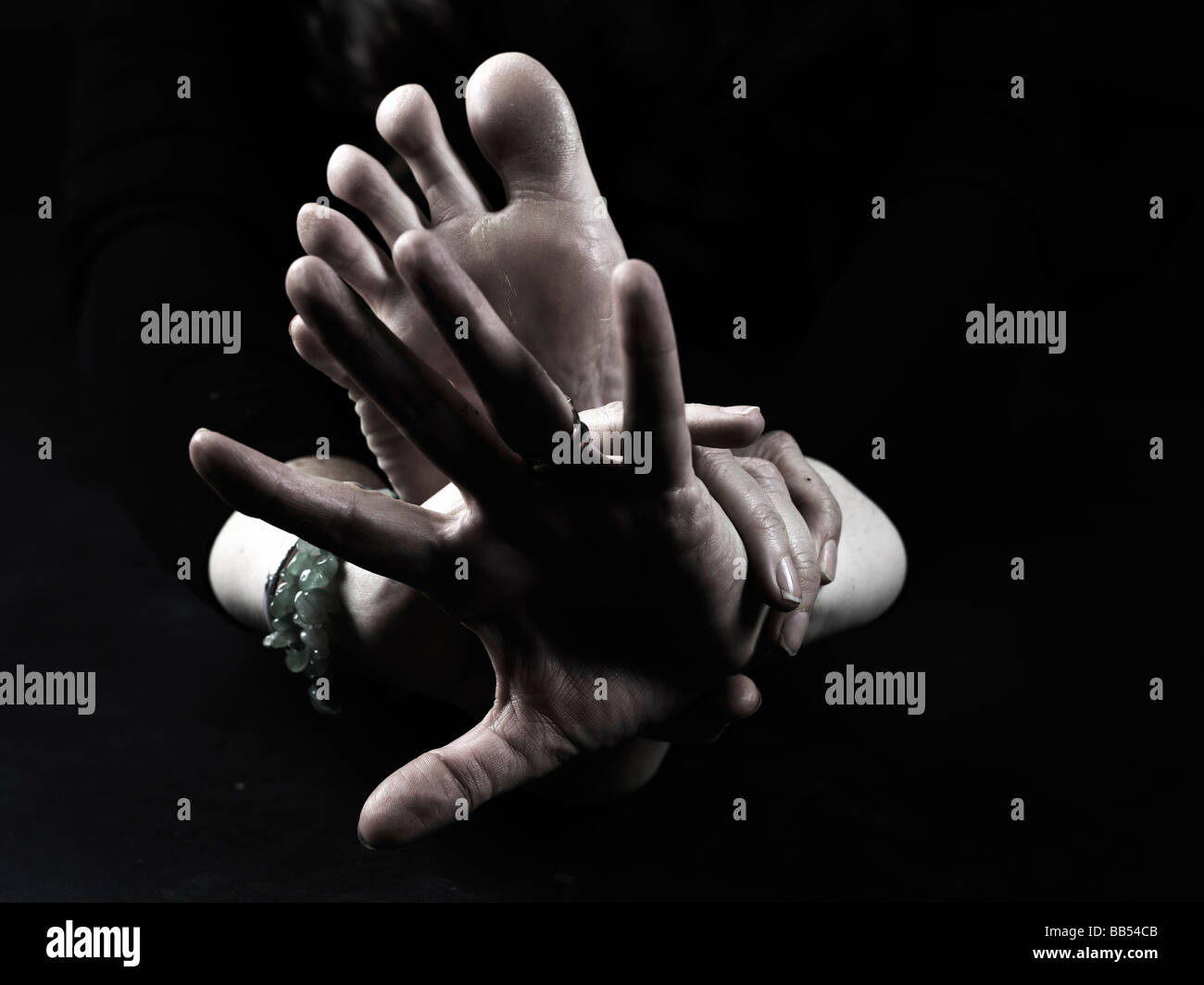 forward bend yoga pose detail hands and foot Stock Photo - Alamy