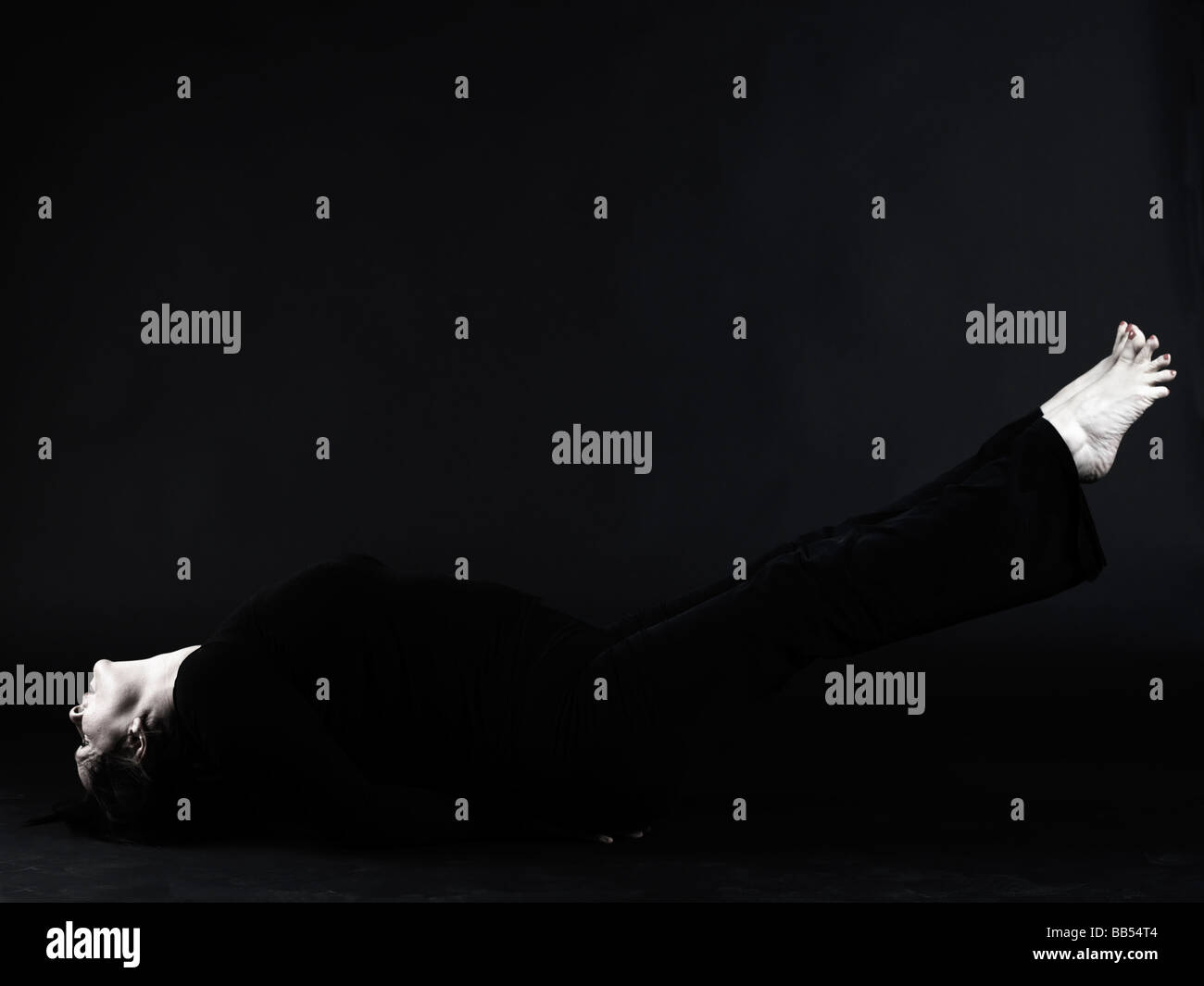 Matsyasana (Fish Pose) yoga raised legs Stock Photo - Alamy