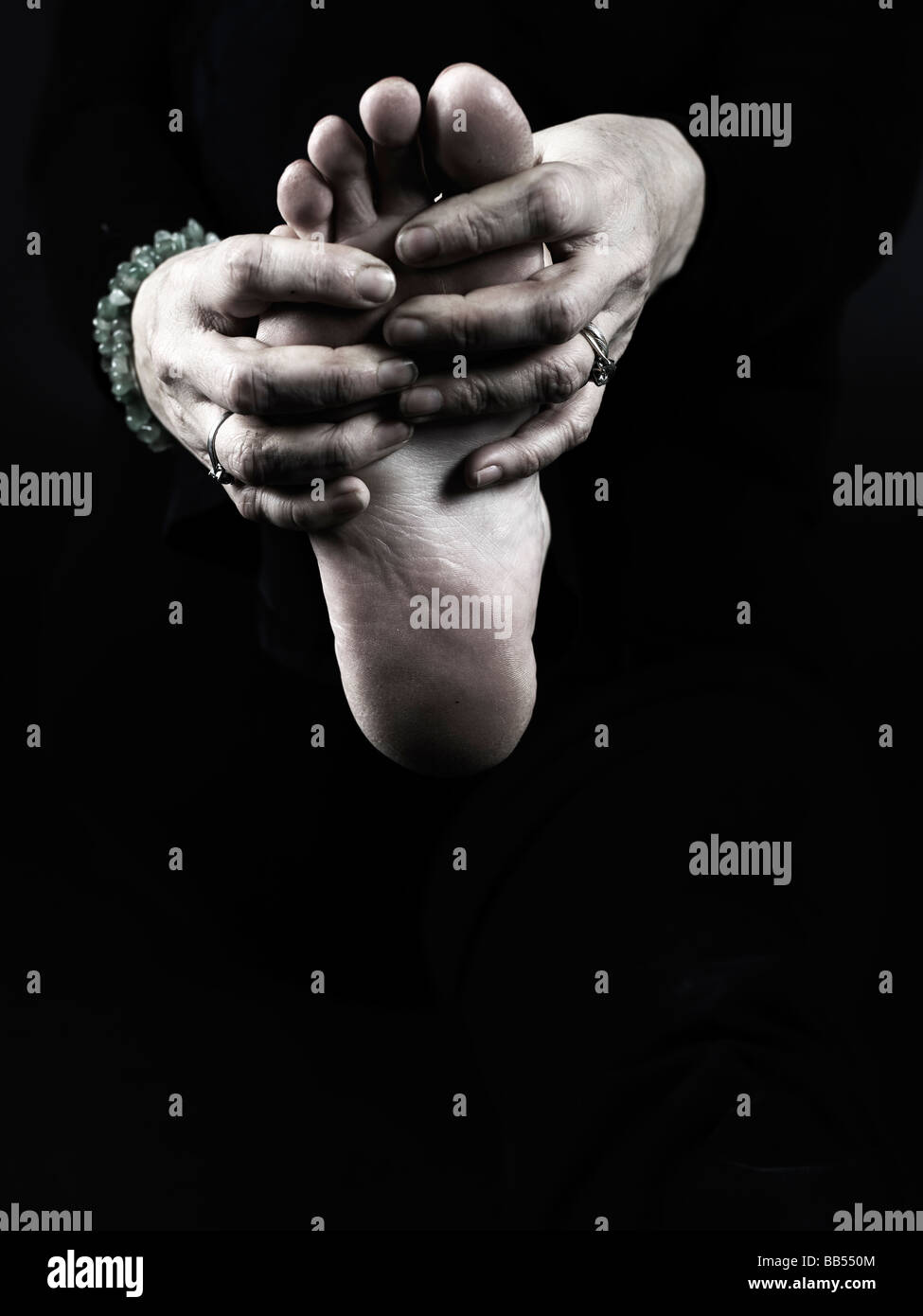 yoga pose detail hands holding foot Stock Photo - Alamy