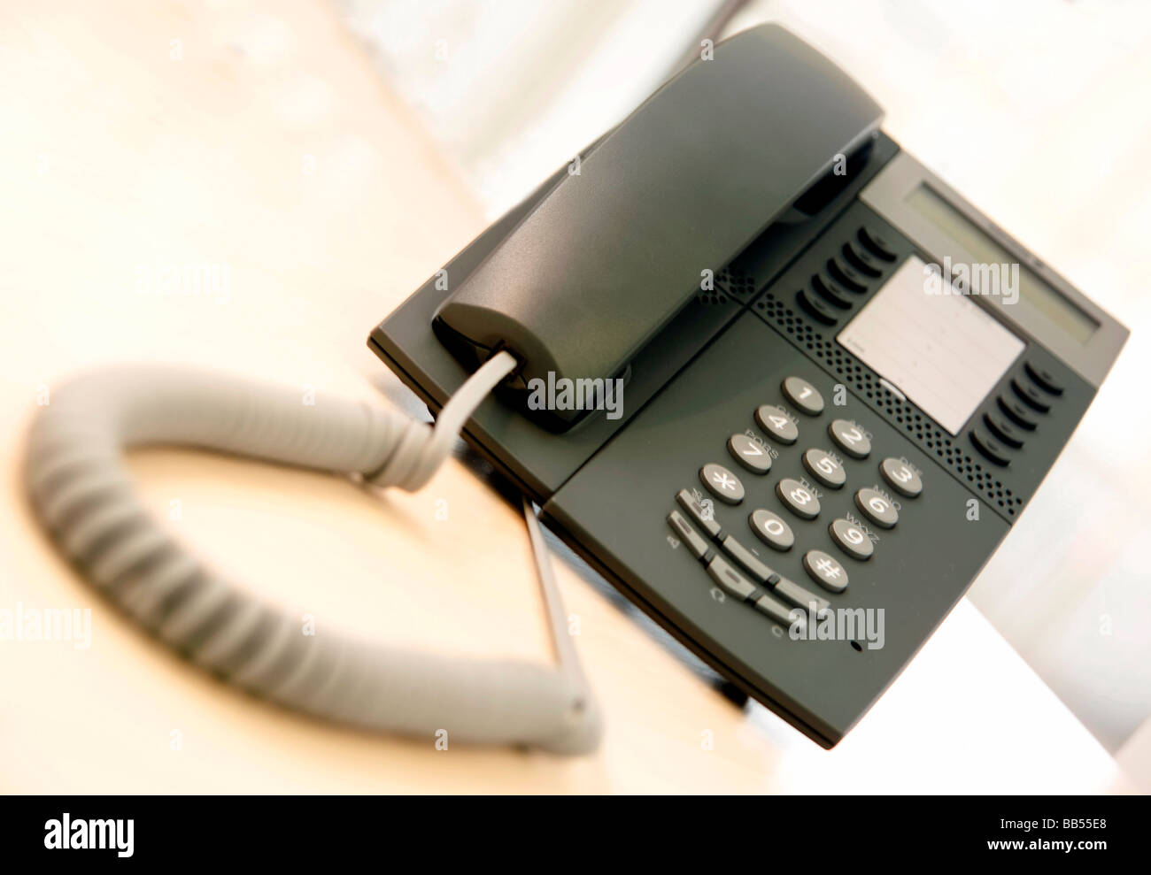 phone on desk in office Stock Photo - Alamy